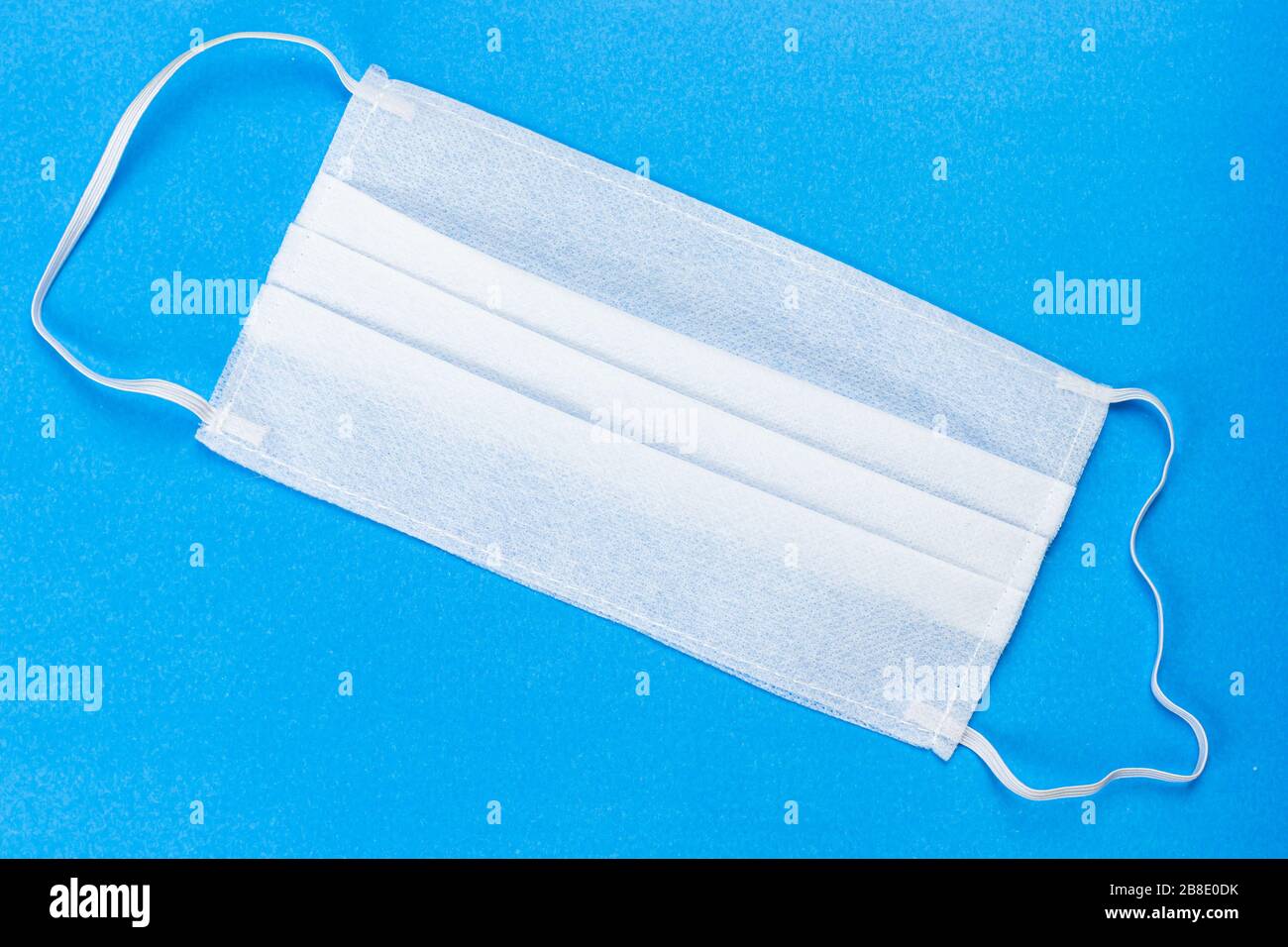 Ear-loop face mask 3 ply, Safety masks on blue background. dust ...