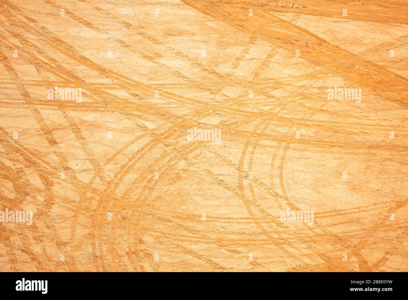 Car traces on construction ground side over dust clay and sand view ...