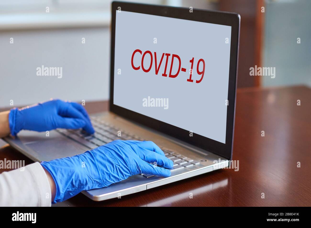 Computer keyboard hands gloves typing hi-res stock photography and ...