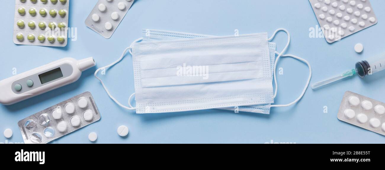 Different types protective medical face mask, pills, thermometer on ...