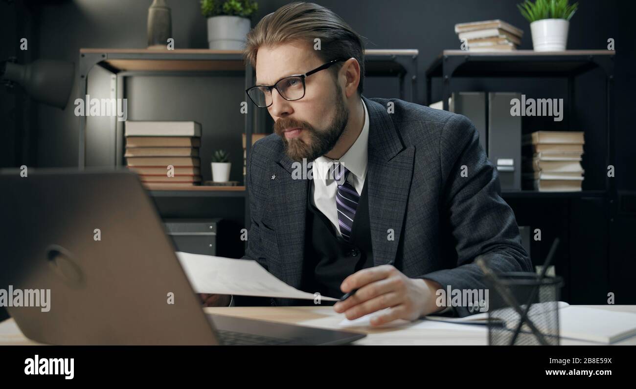 Adult businessman checking data Stock Photo - Alamy