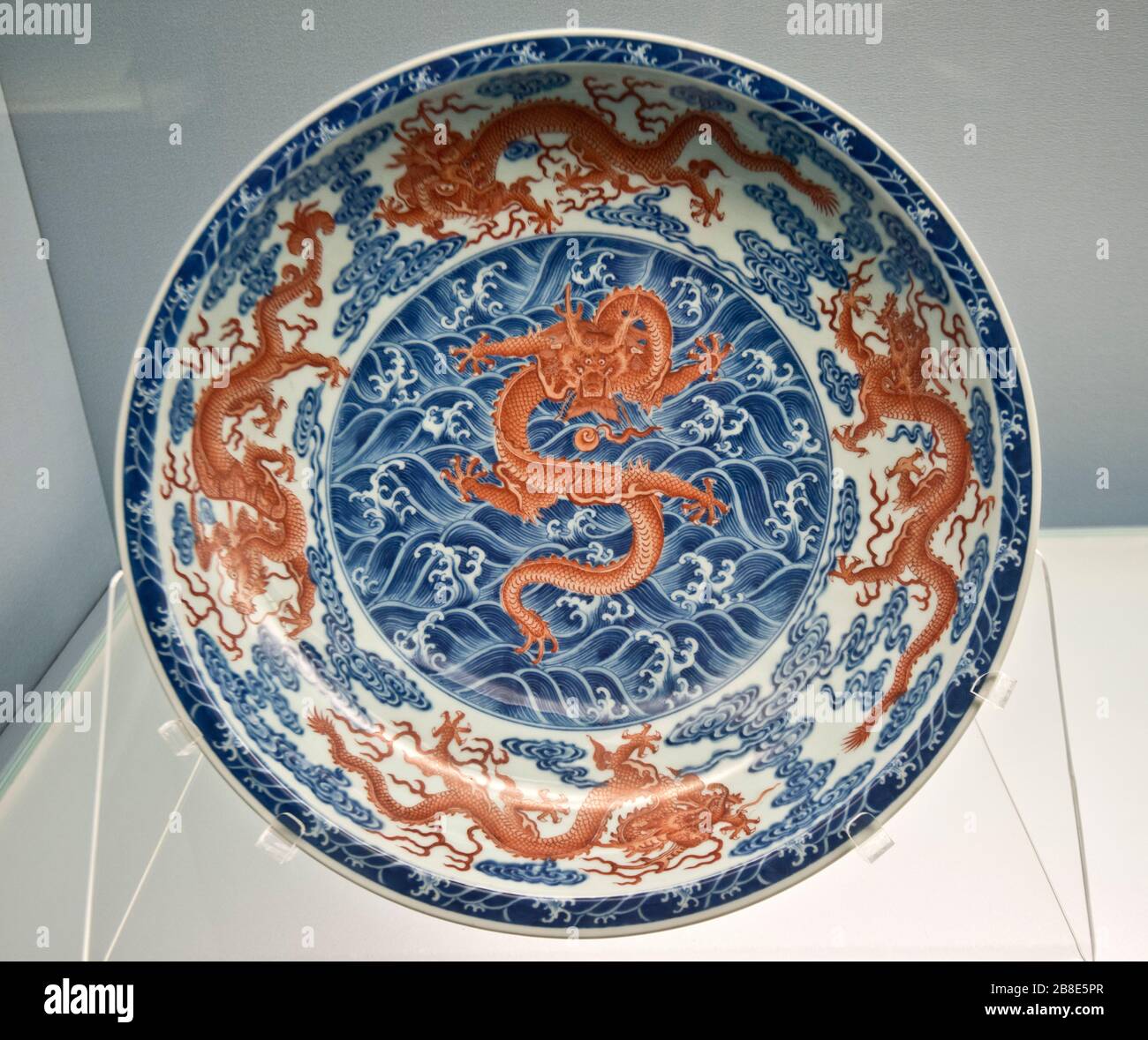 Dish with underglaze blue and overglaze red design of clouds and ...