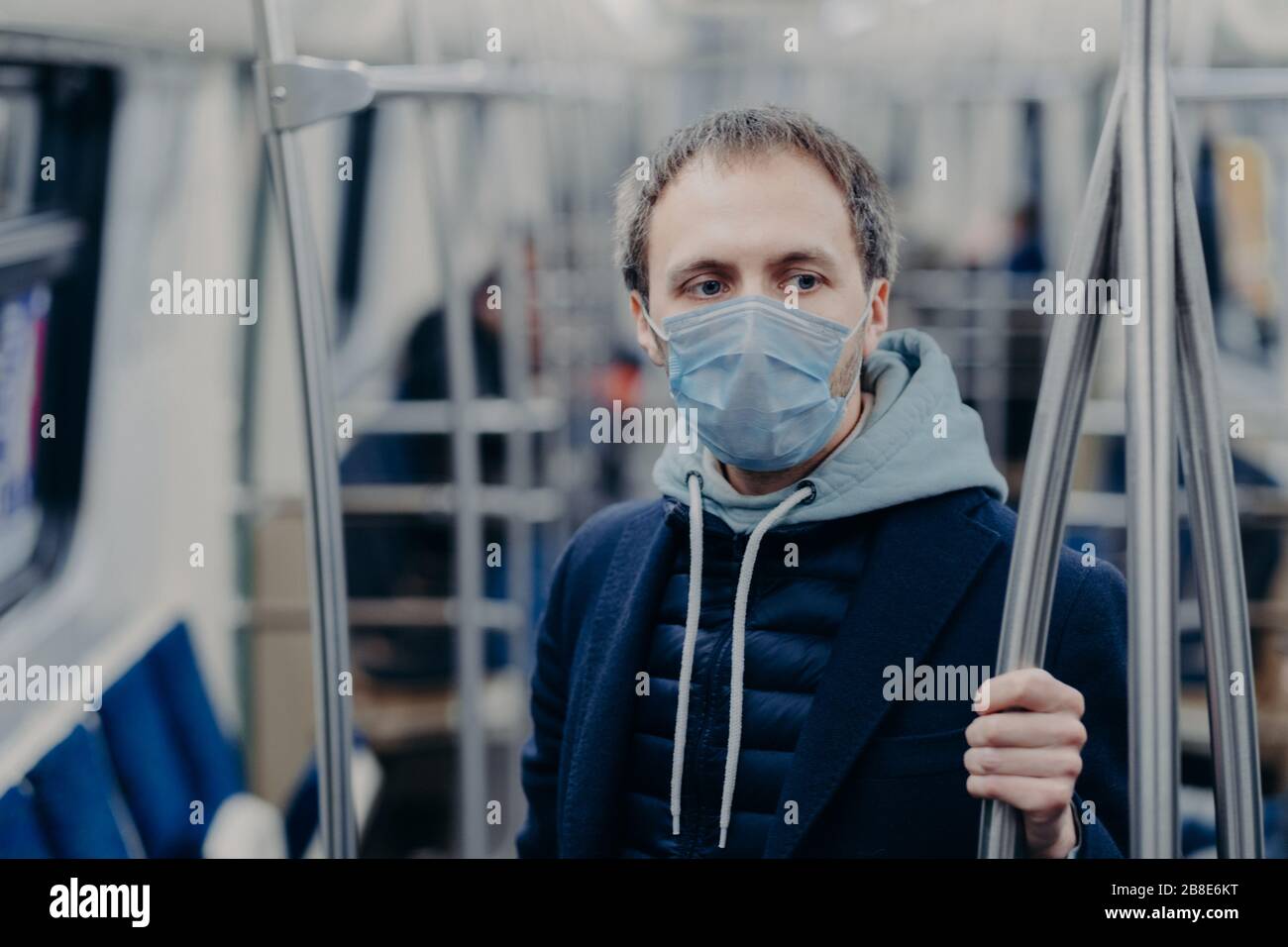 Photo of male passenger wears face mask while travels by subway during ...