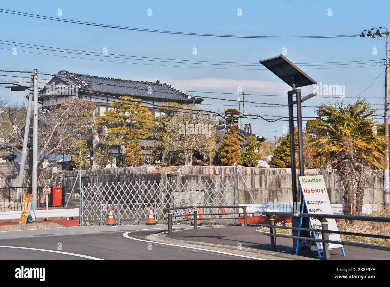 Futaba, Japan. 21st Mar, 2020. A fence prevents people from entering ...