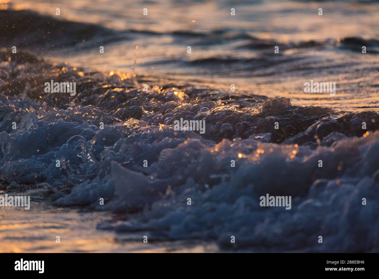 sea waves warm red sunset beach of the ocean Stock Photo - Alamy