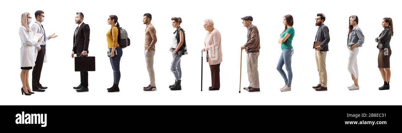 Full length profile shot of male and female doctor with medical masks ...