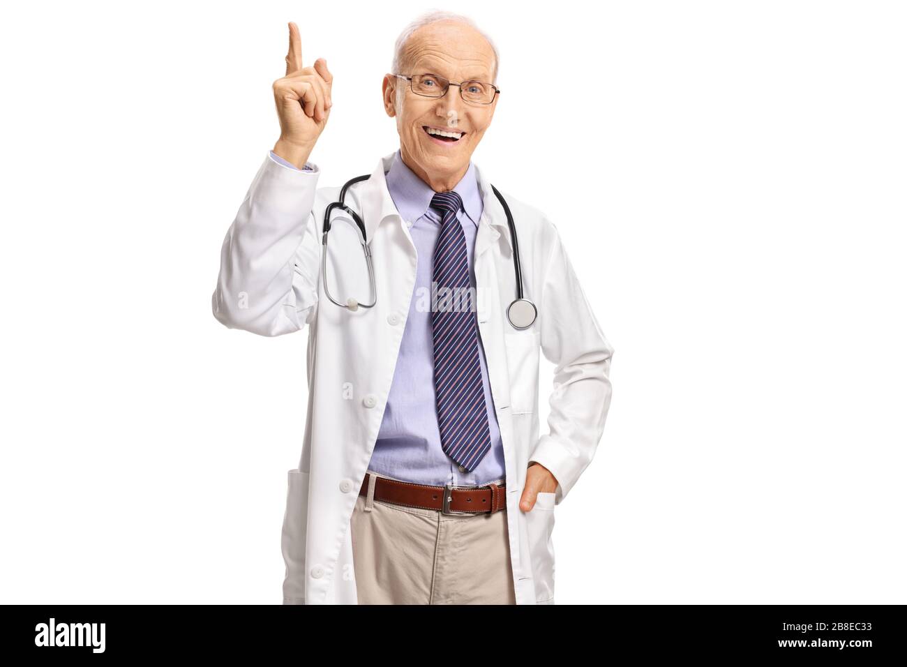 Elderly doctor pointing up with his finger isolated on white background ...