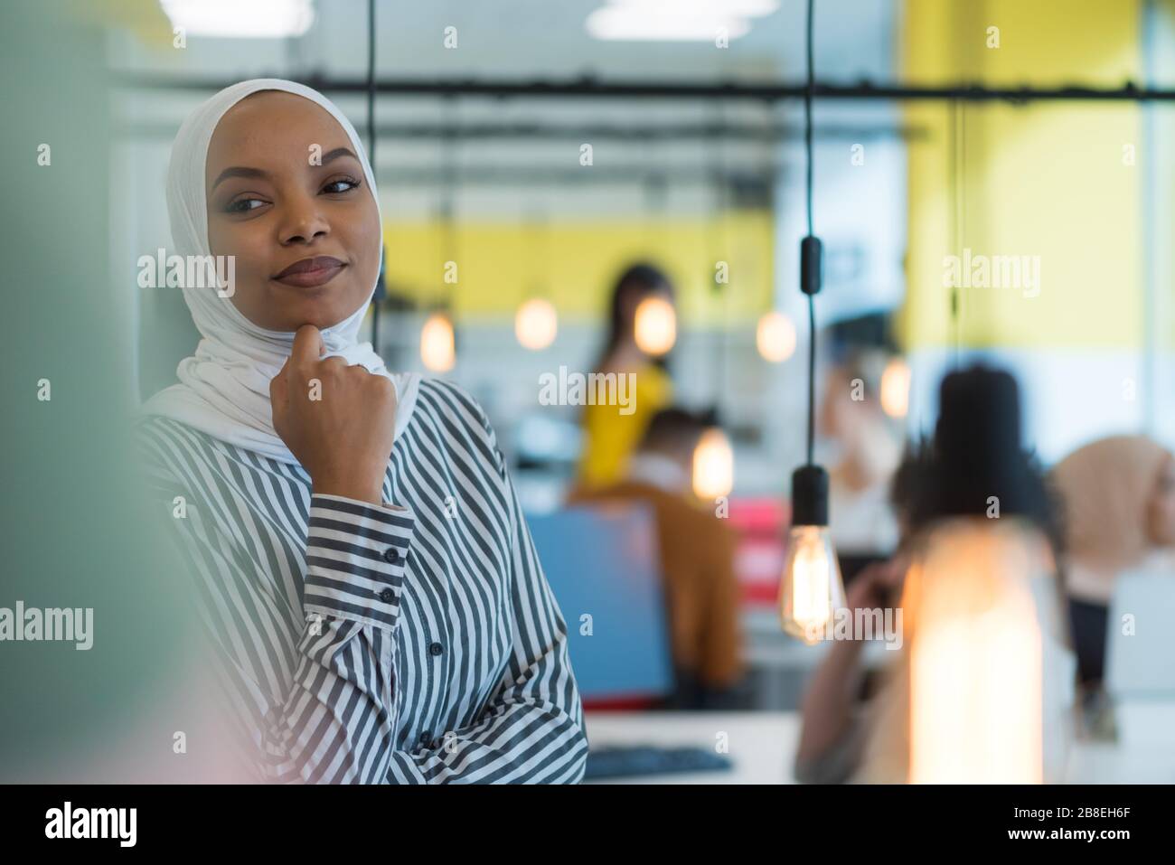 Young muslim African American business woman as a leader at work ...