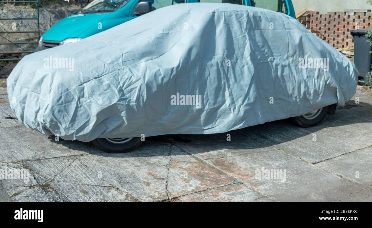 a close up view of a car that has been covered to protect it from the ...
