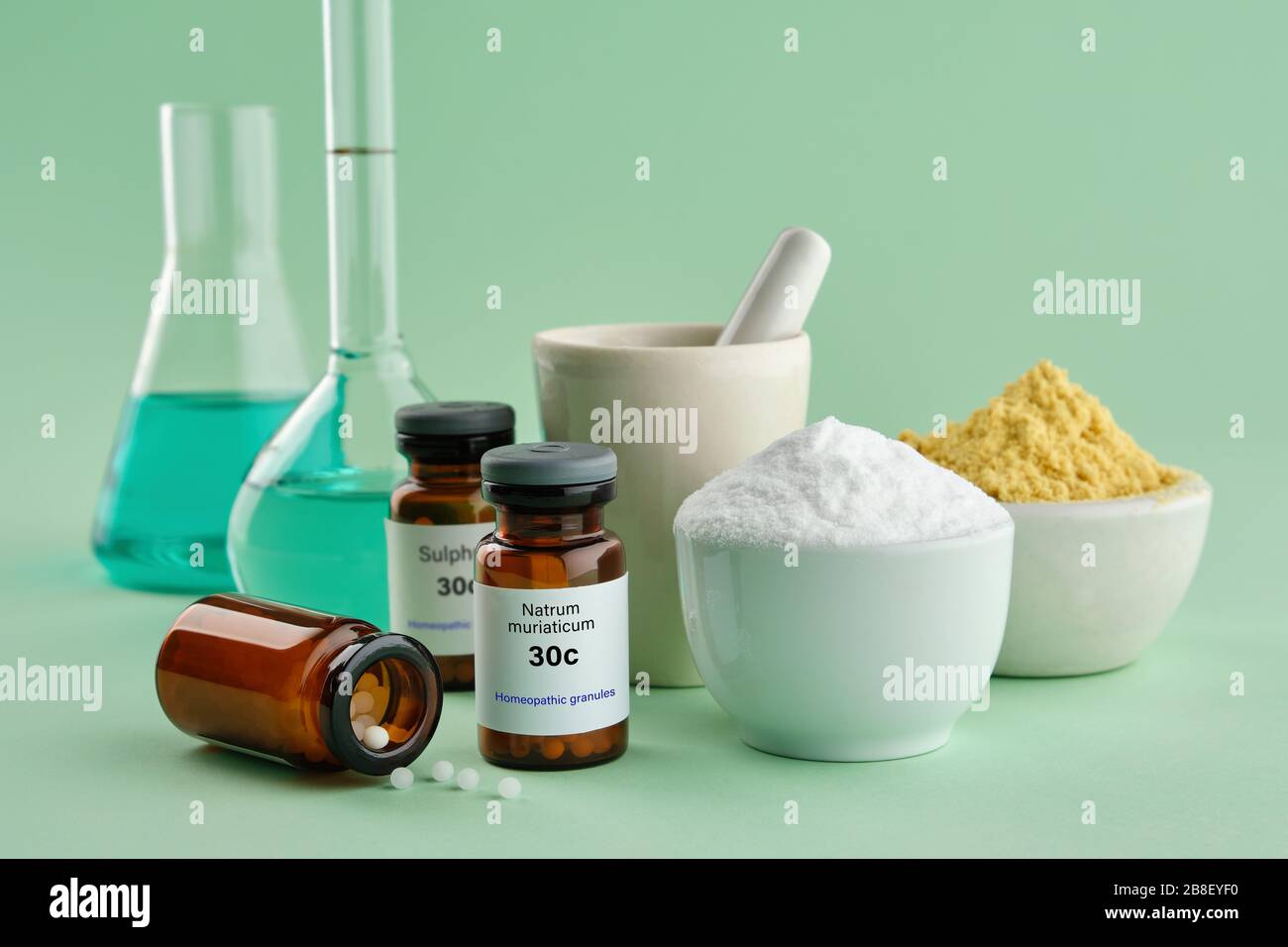 Bottles of homeopathic drugs - Natrum muriaticum, Sulphur, substances ...