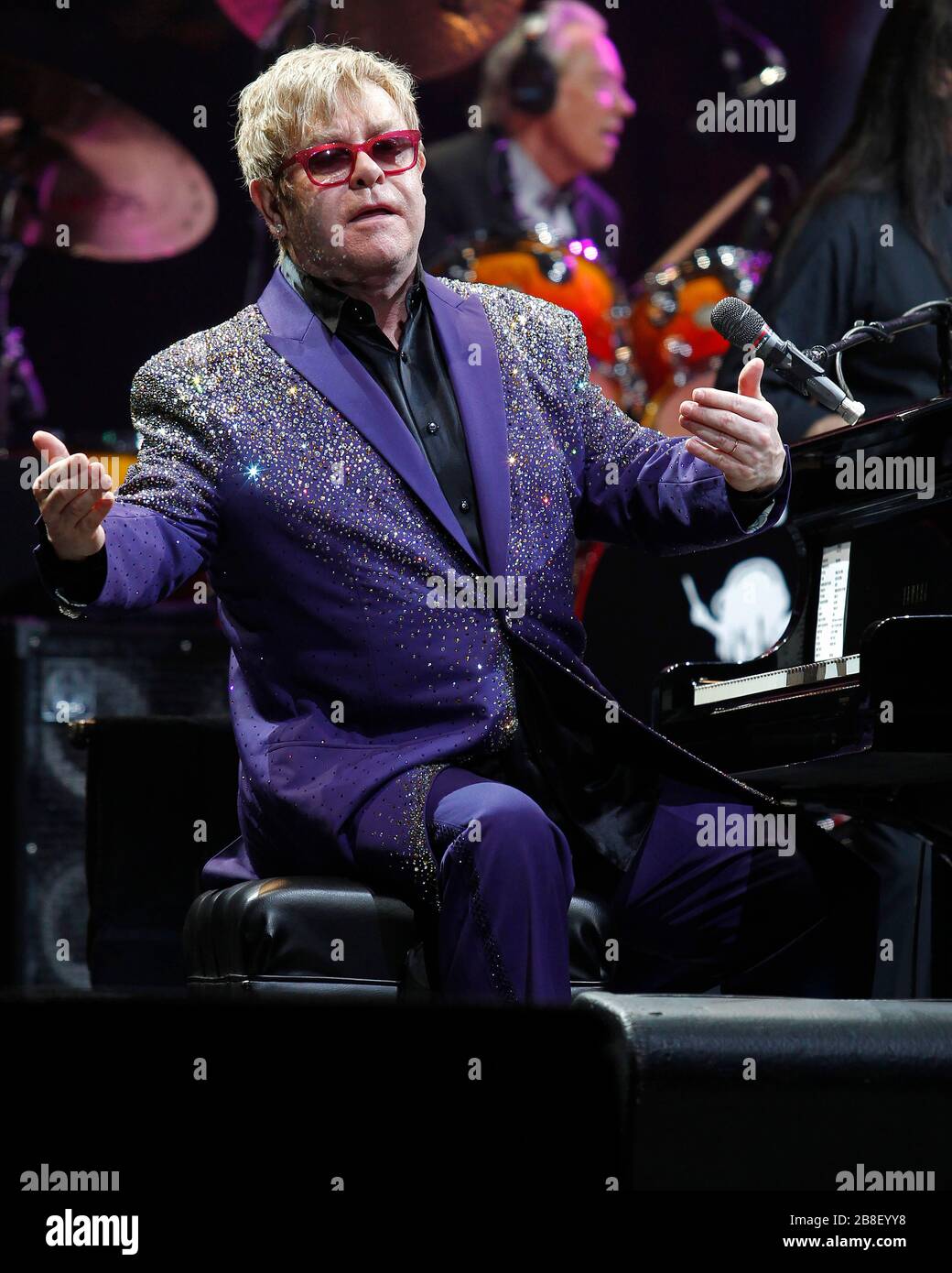 Singer Elton John performs drummer Nigel Olsson and the rest of the ...