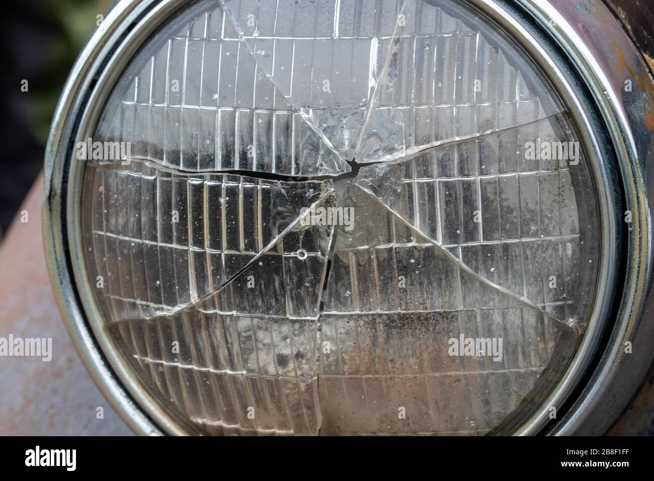 Broken headlight on an old junked automobile Stock Photo - Alamy