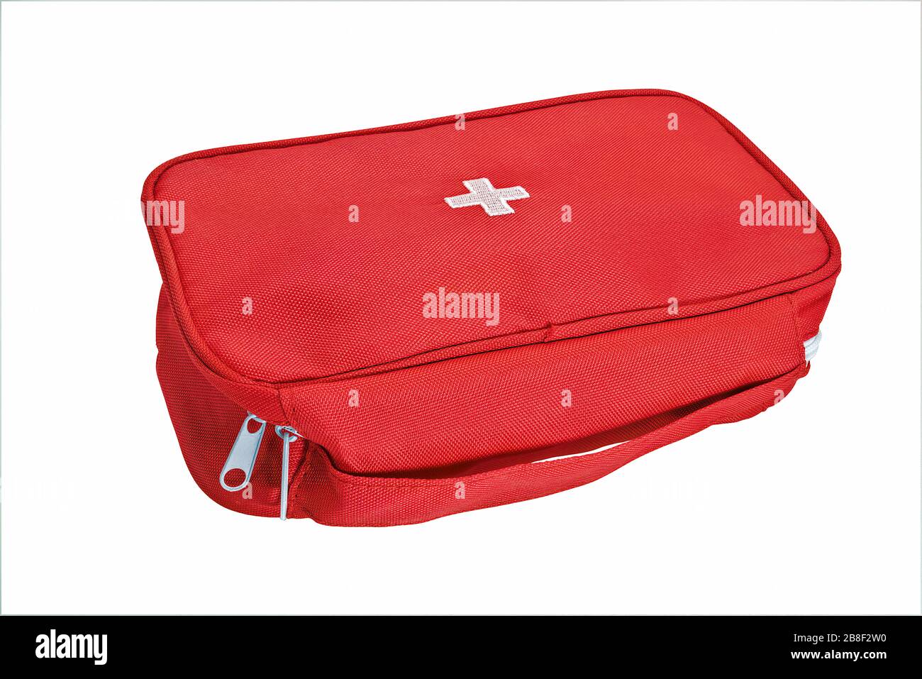 Top view on the red first aid kit box close-up isolate on a white ...