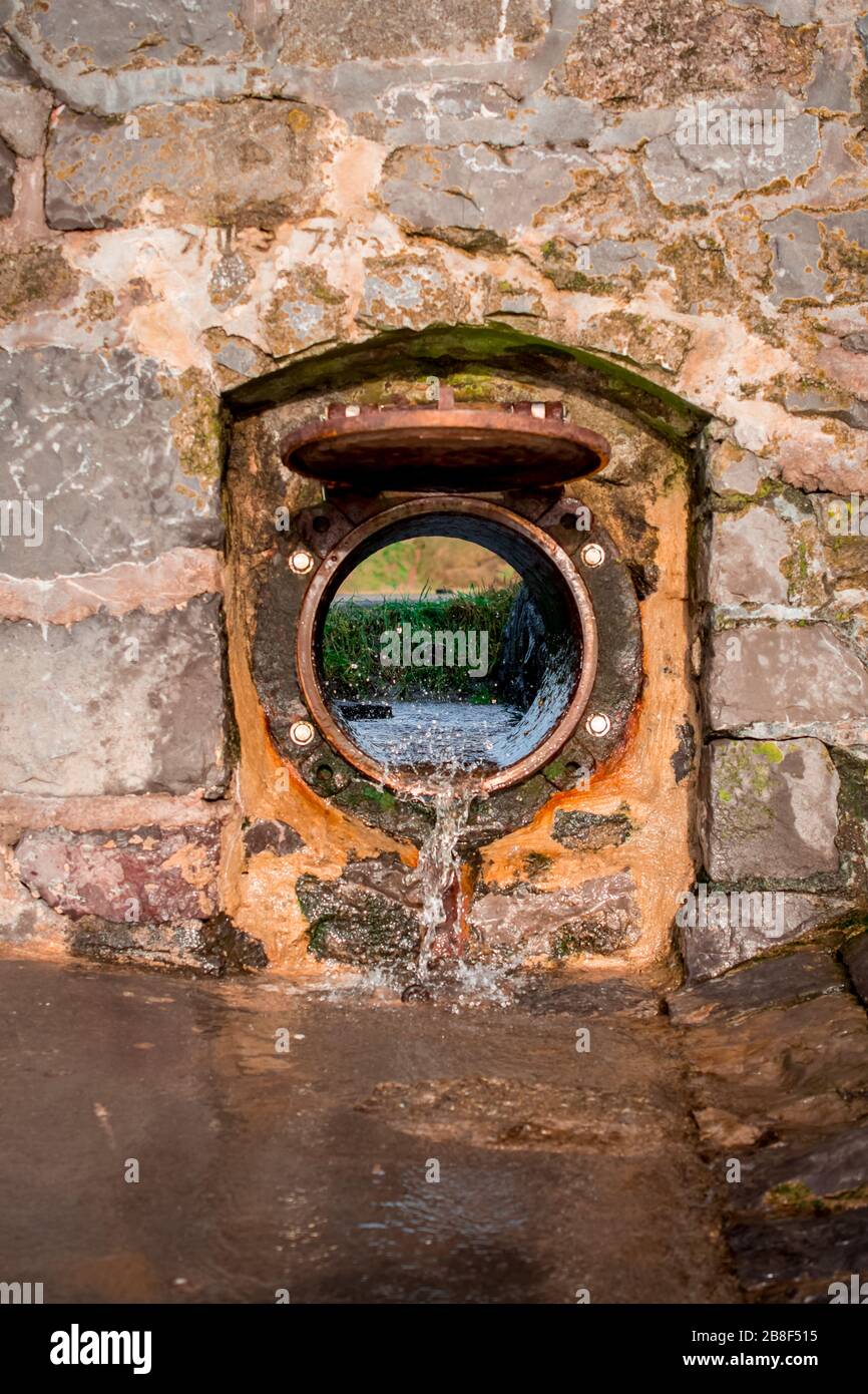 sewer water pipe outlet beach Stock Photo - Alamy