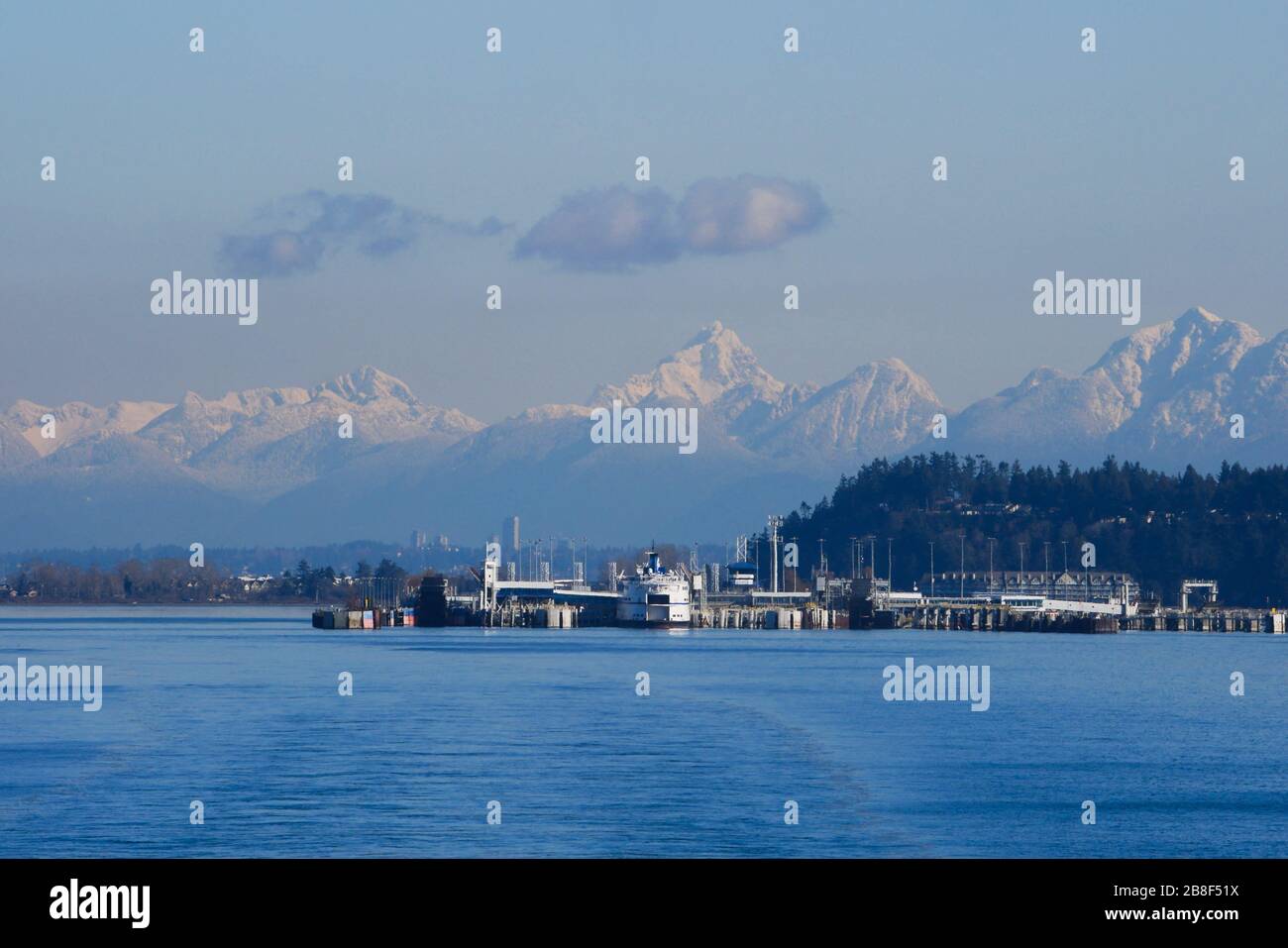 Vancouver ferry port view with mountain backdrop Stock Photo - Alamy