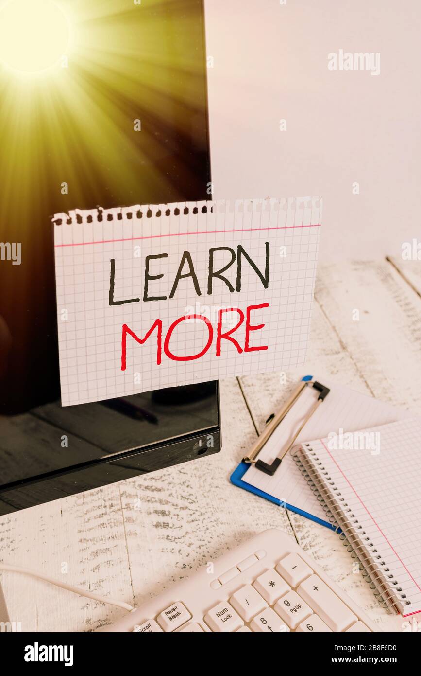 Writing note showing Learn More. Business concept for to get knowledge ...