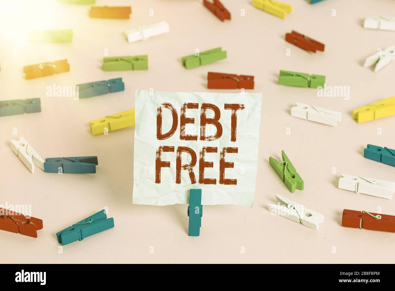Writing note showing Debt Free. Business concept for does not owning ...