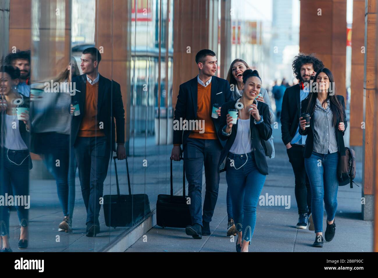 Group of colleagues on a business trip (euro trip) walking together at ...