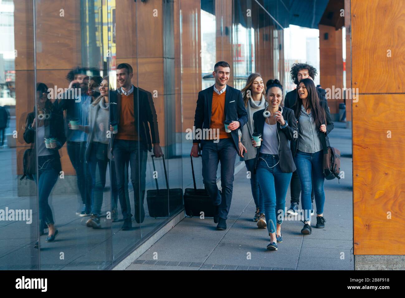 Group of colleagues on a business trip (euro trip) walking together at ...