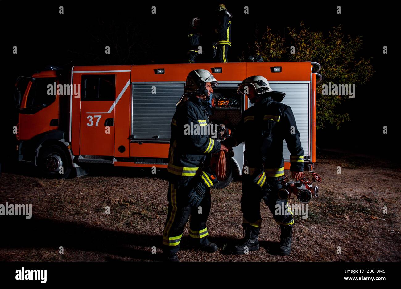 Fire station crew responding to fire emergency situation Stock Photo ...