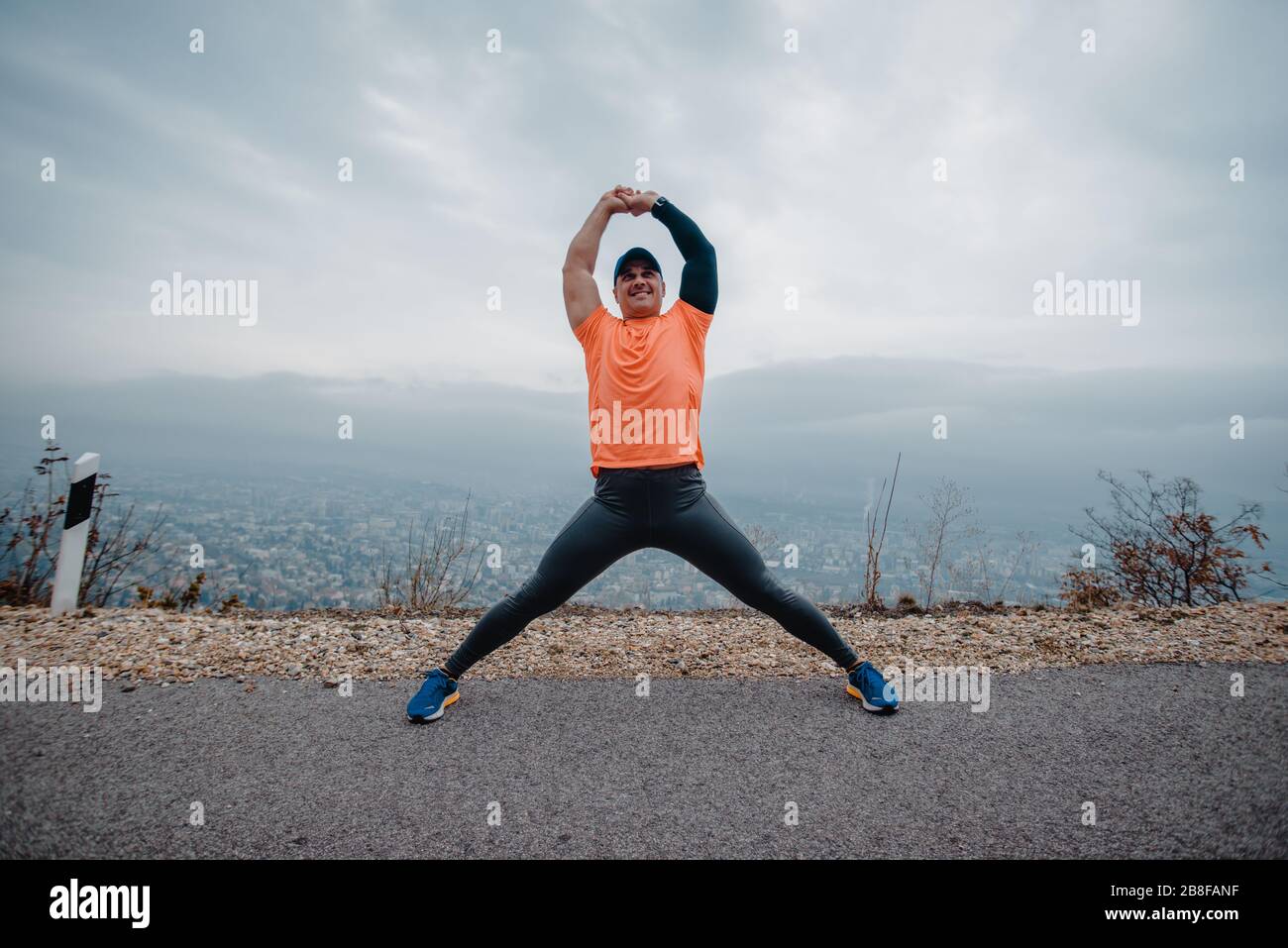 Middle aged man in good shape getting ready for an outdoors exercise ...