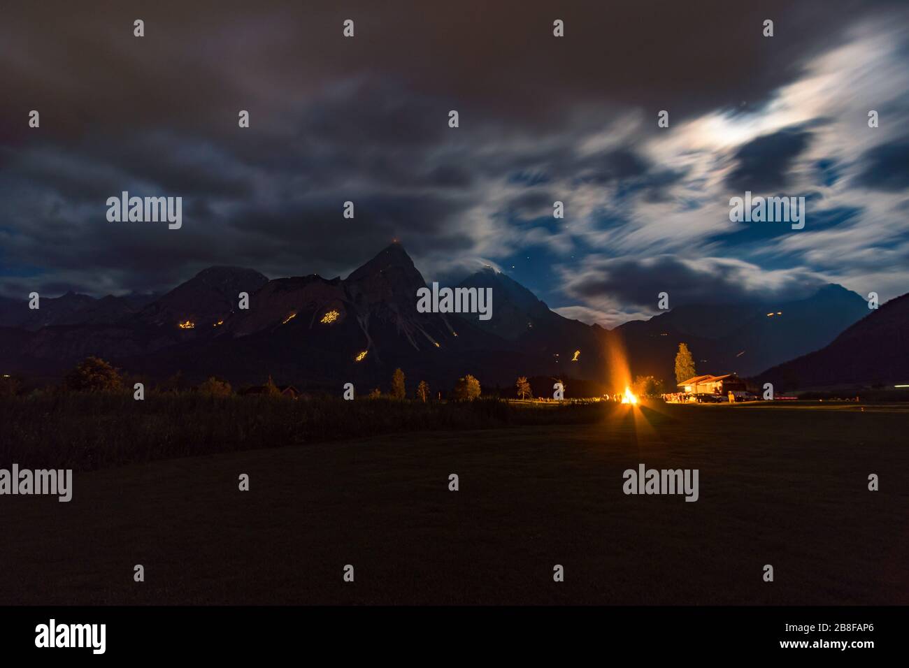 Traditional mountain fire and solstice fire near Ehrwald at the Tiroler ...