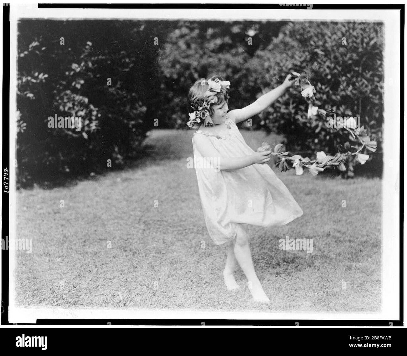 Flowers in her hair Cut Out Stock Images & Pictures - Alamy