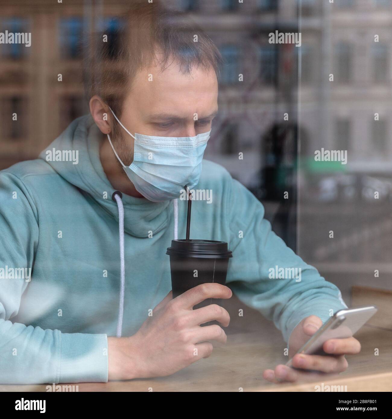 Man drink coffee through a straw hi-res stock photography and images ...