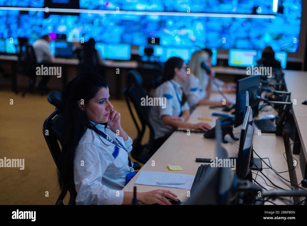 Group of Security data center operators (administrators) working in a ...