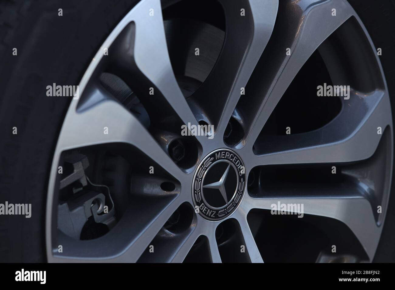 A logo of a Mercedes-Benz is seen on a wheel Stock Photo - Alamy