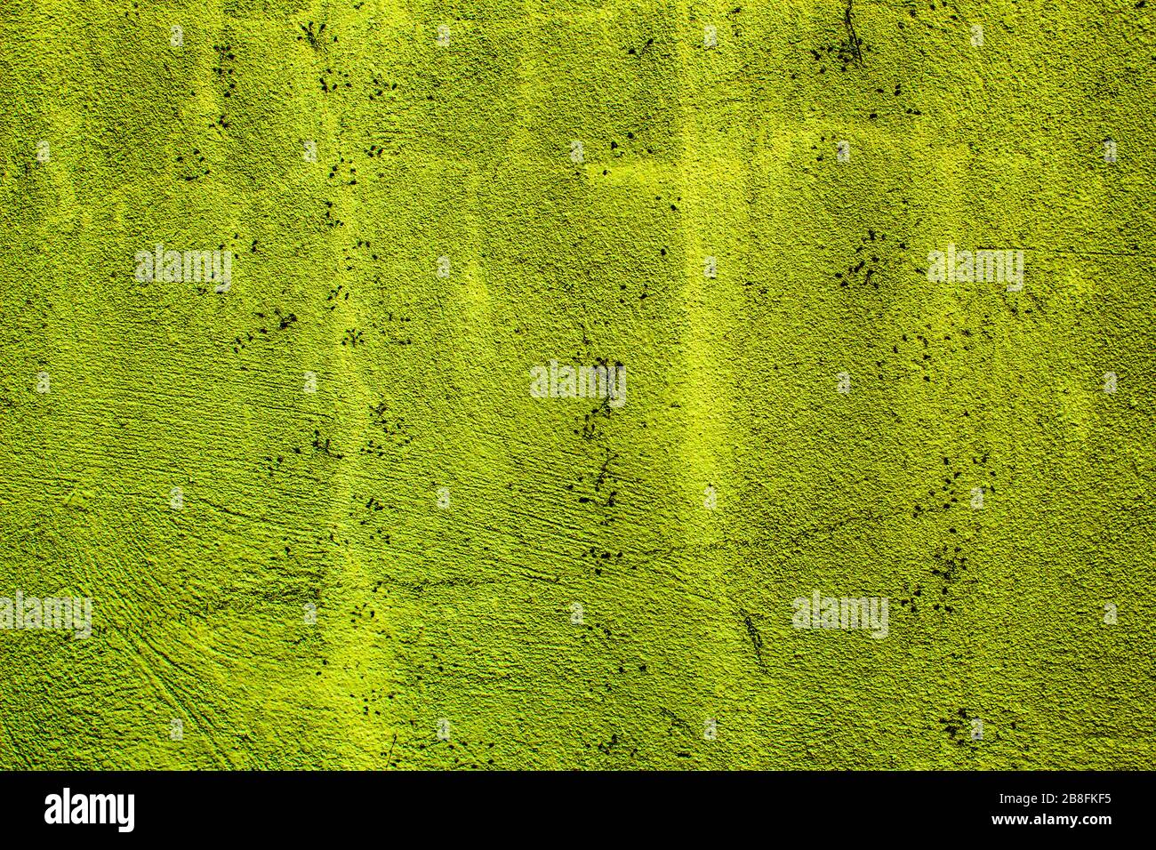 Yellow colored abstract wall background with textures of different ...