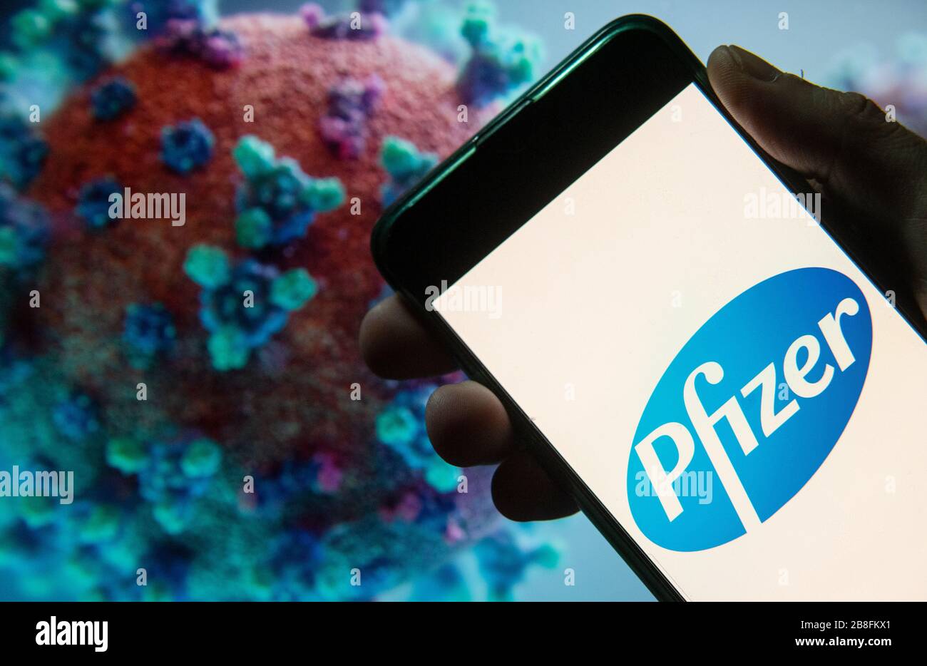 In this photo illustration the American multinational pharmaceutical ...