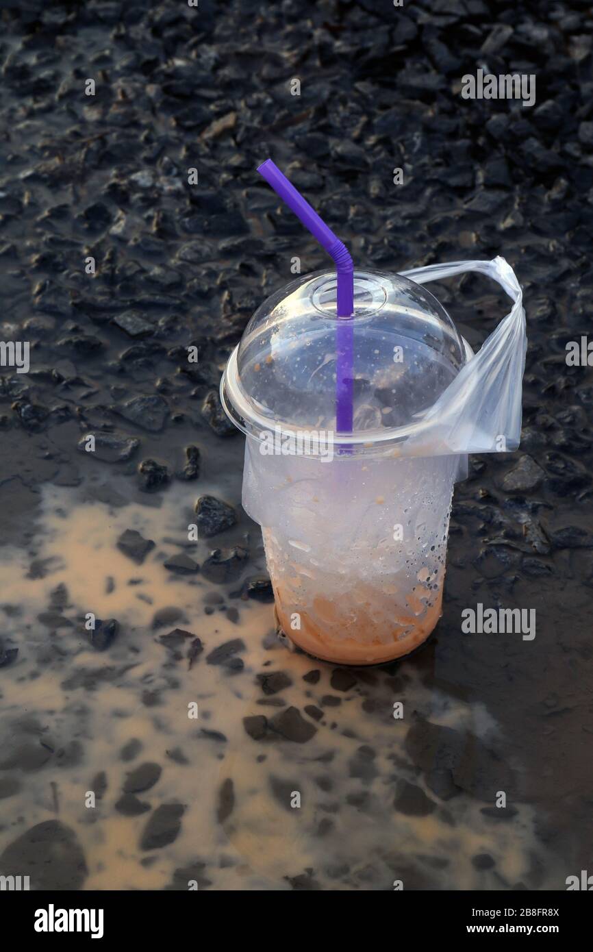 waste trash drink glass, water cup Juice dirty on floor Stock Photo - Alamy