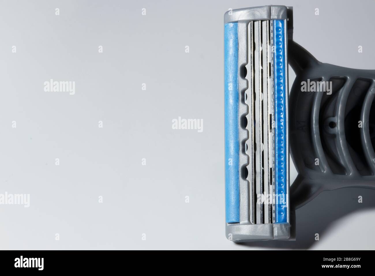 Shaving blade close-up with blue and gray colors. . The razor is on the ...