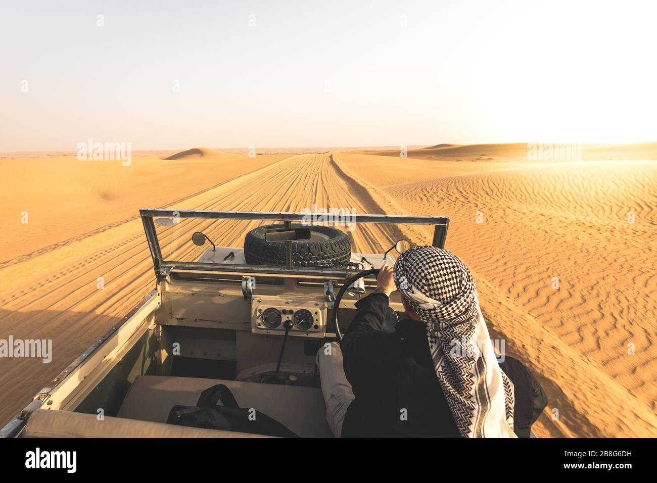 Driving Land Rover in the desert of Dubai - UAE Stock Photo - Alamy