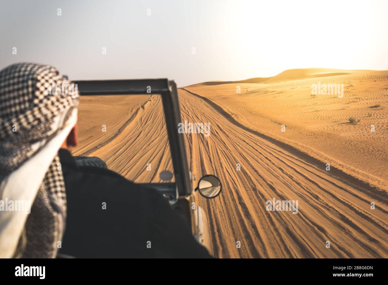Driving Land Rover in the desert of Dubai - UAE Stock Photo - Alamy