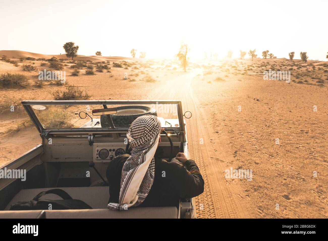 Driving Land Rover in the desert of Dubai - UAE Stock Photo - Alamy