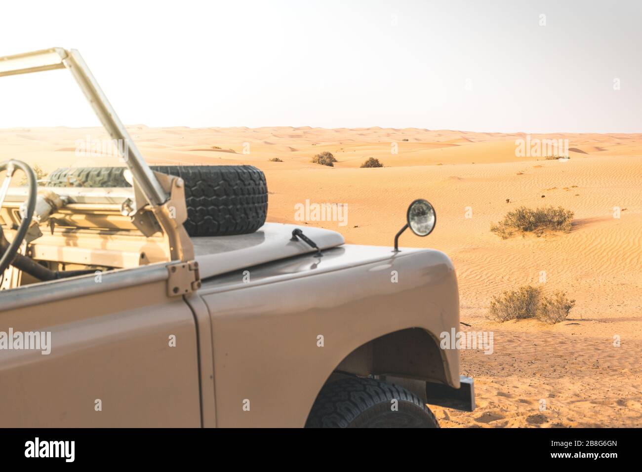 Land Rover in the desert of Dubai - UAE Stock Photo - Alamy