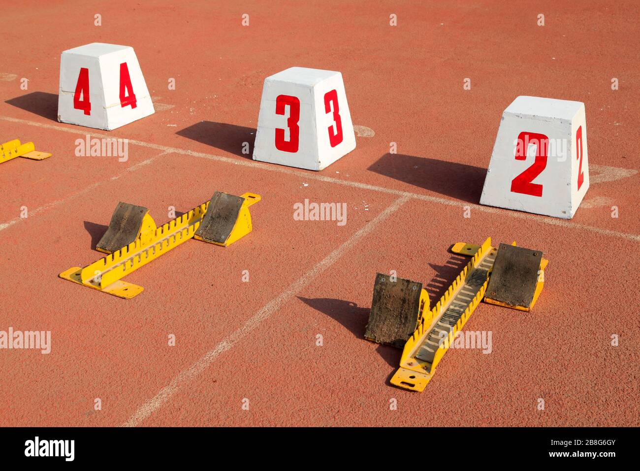The starting blocks are on the track in the playground Stock Photo - Alamy