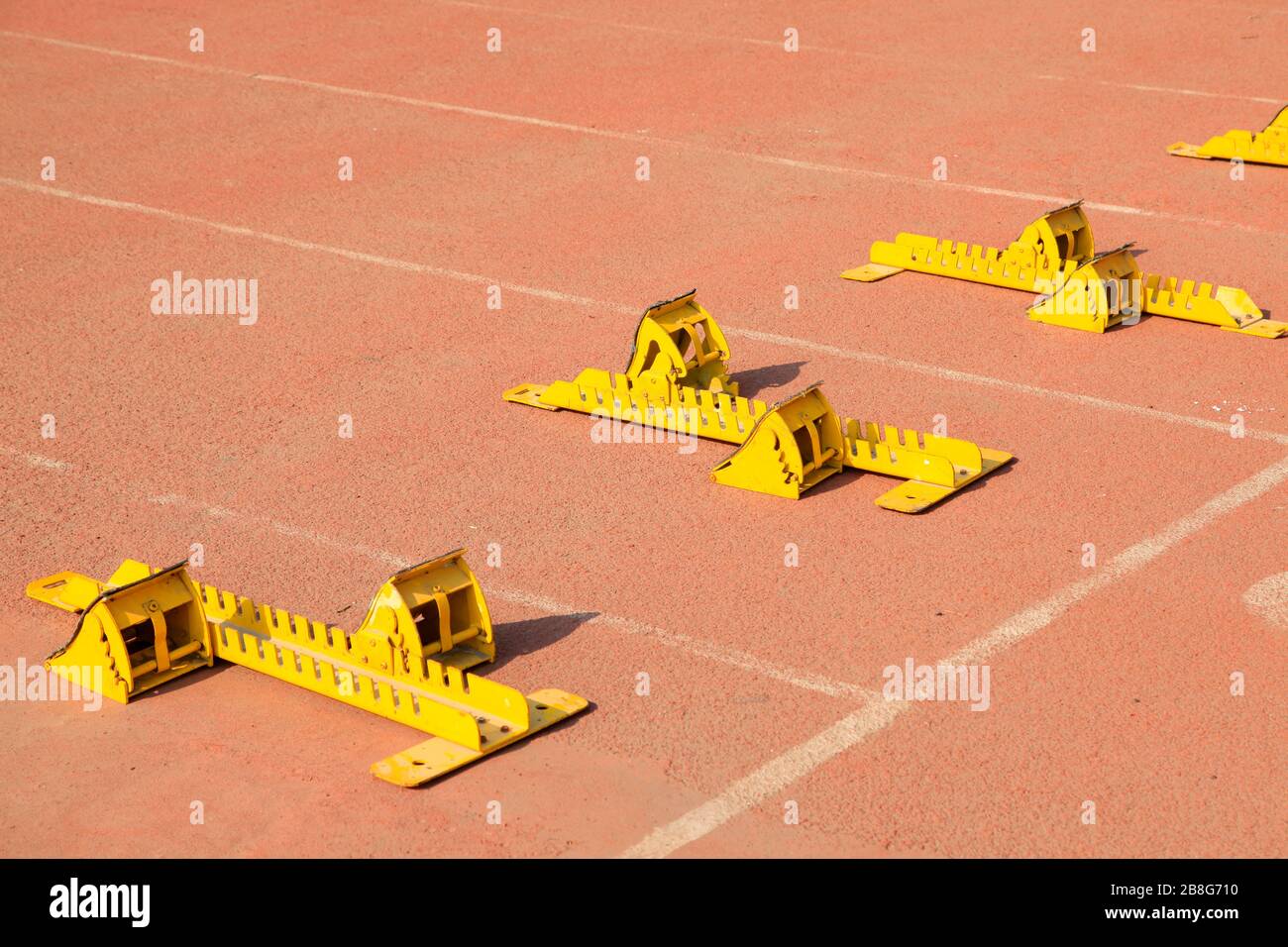 The starting blocks are on the track in the playground Stock Photo - Alamy