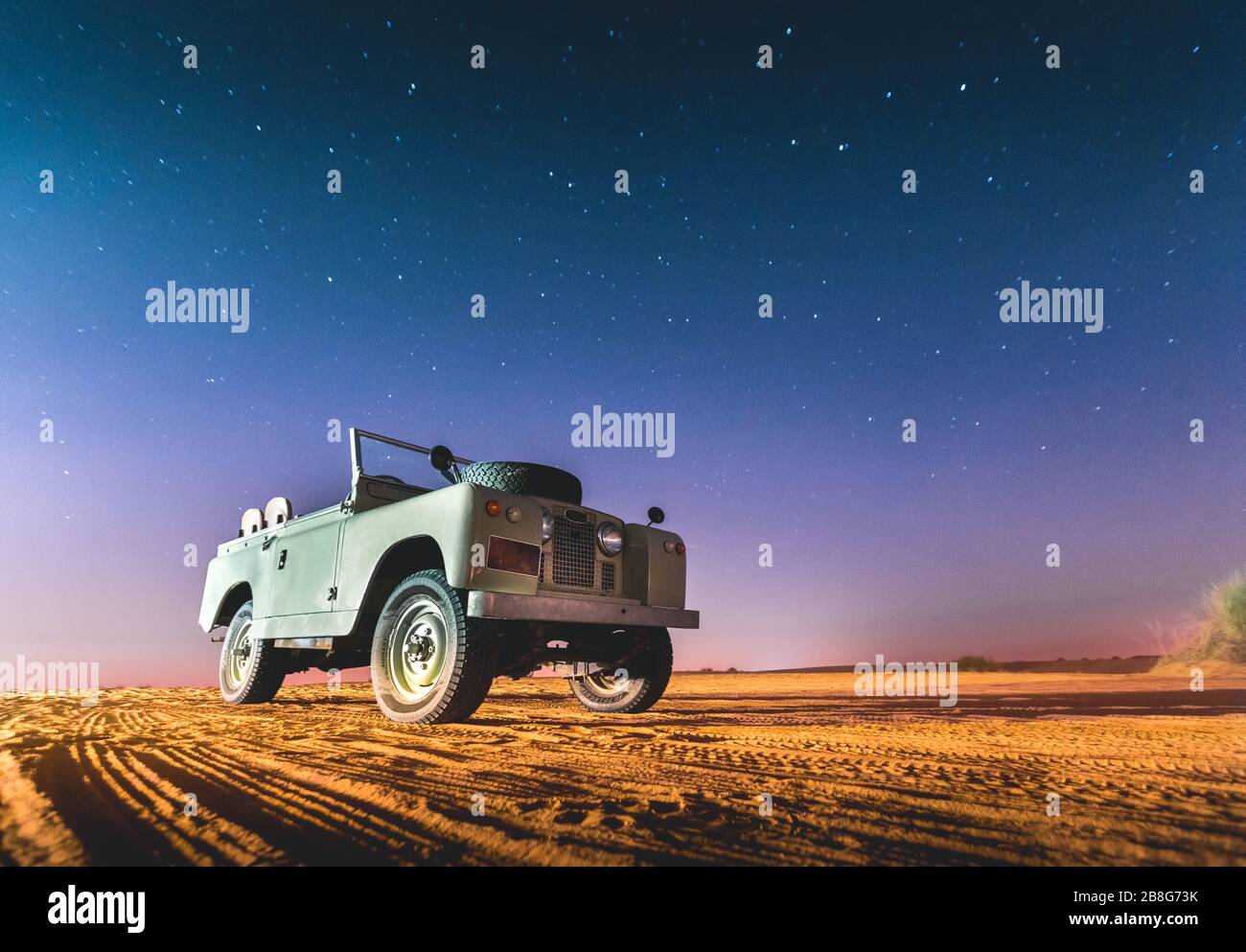 Land Rover and starry sky at night in the desert of Dubai - UAE Stock ...