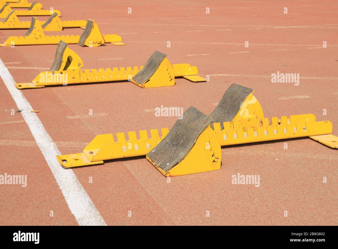 The starting blocks are on the track in the playground Stock Photo - Alamy