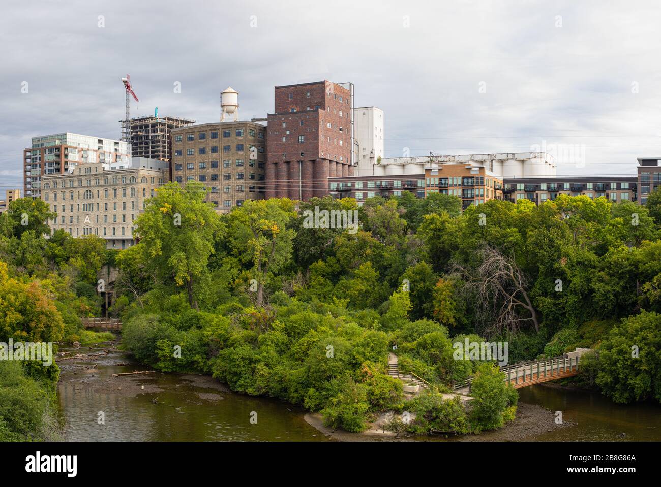 View down Mississippi River with view of the Old Mills on the riverbank ...