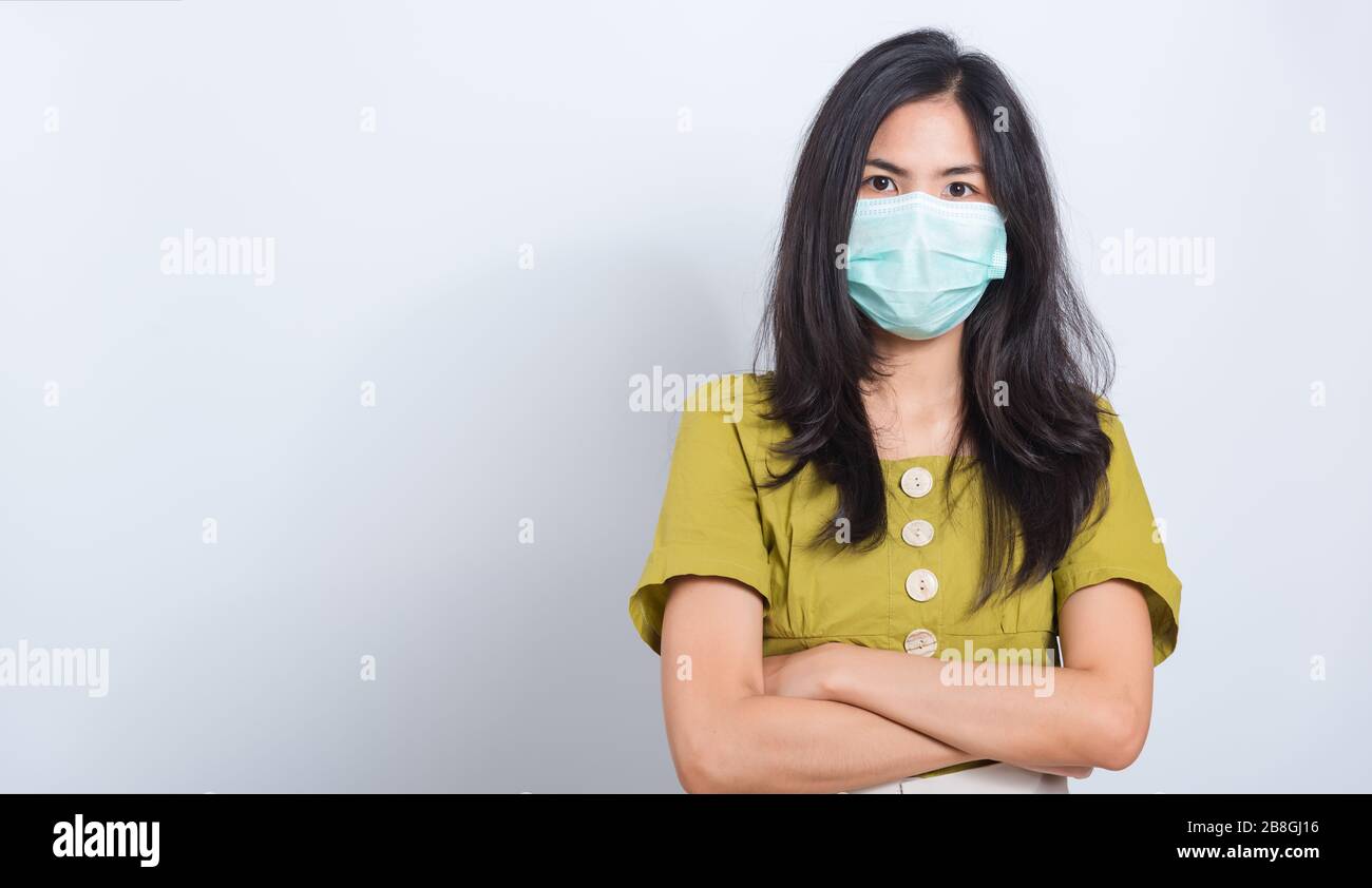 Portrait Asian beautiful happy young woman wearing face mask protects ...