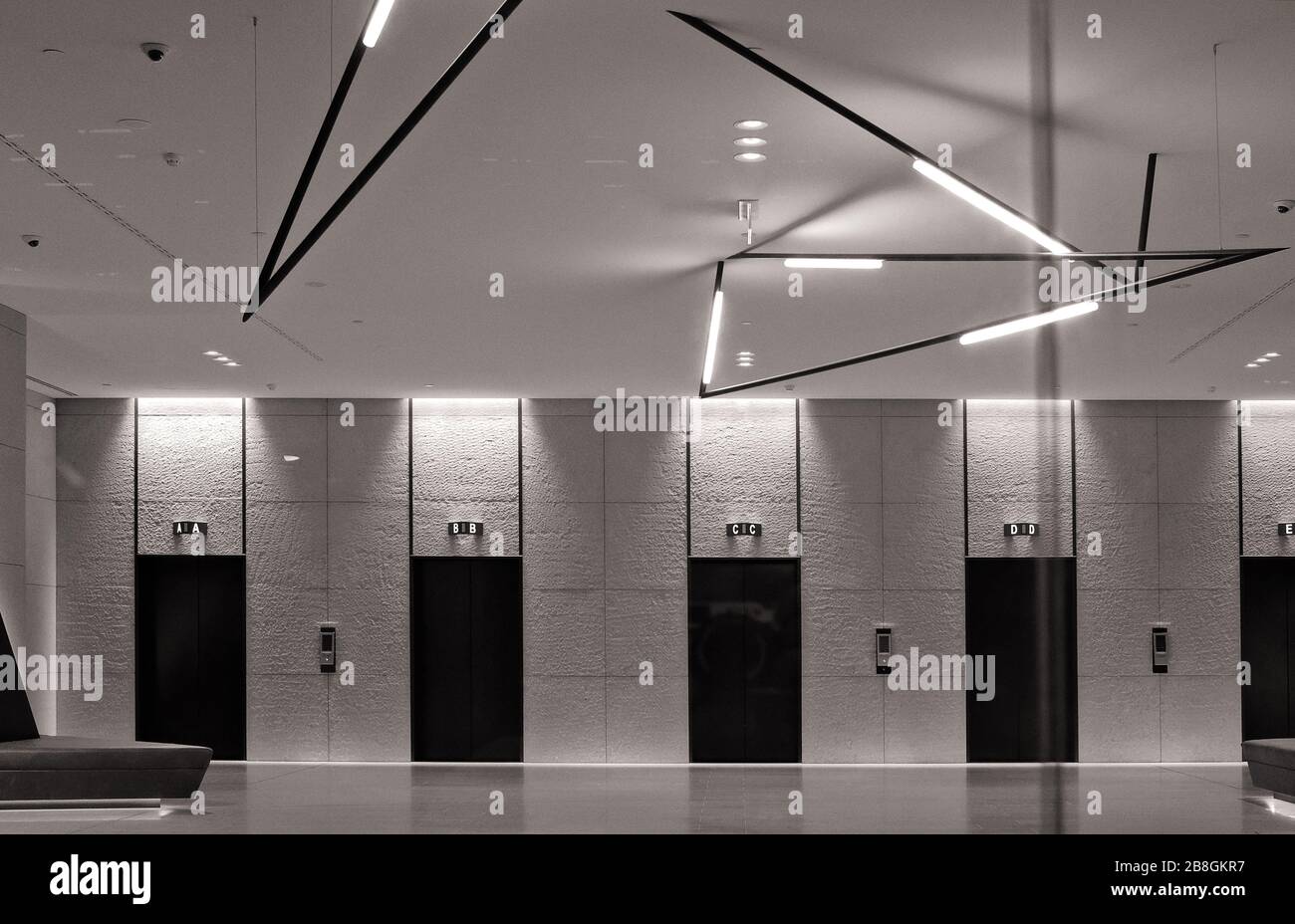 Modern corporate hi-rise foyer with monochrome colour scheme, geometric ...