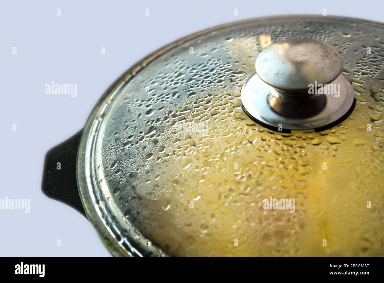pan, hot food under a glass lid, food heat treatment Stock Photo - Alamy