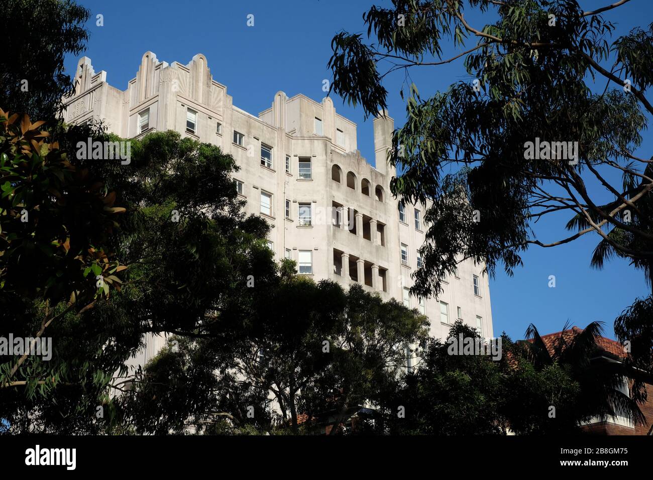 Side view through trees Art Deco Apartment block, Adereham Hall or ...
