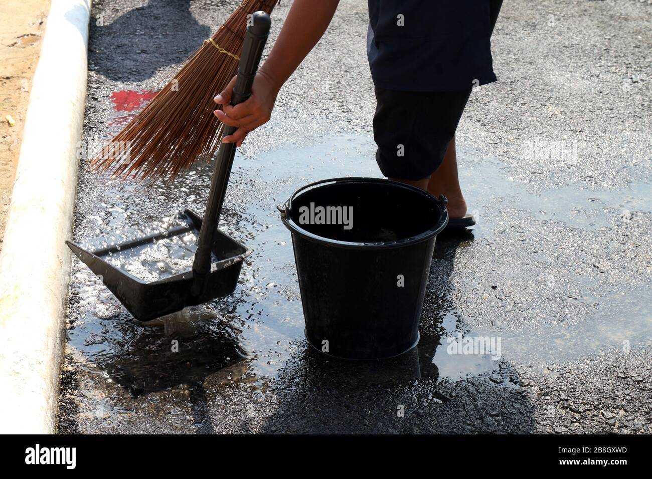 people are sweeping dirty water at ground streets, cleaner floor ...