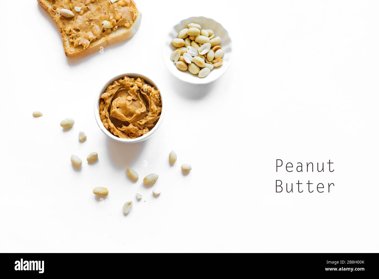 Homemade Peanut Butter, toast and roasted peanuts isolated on white ...