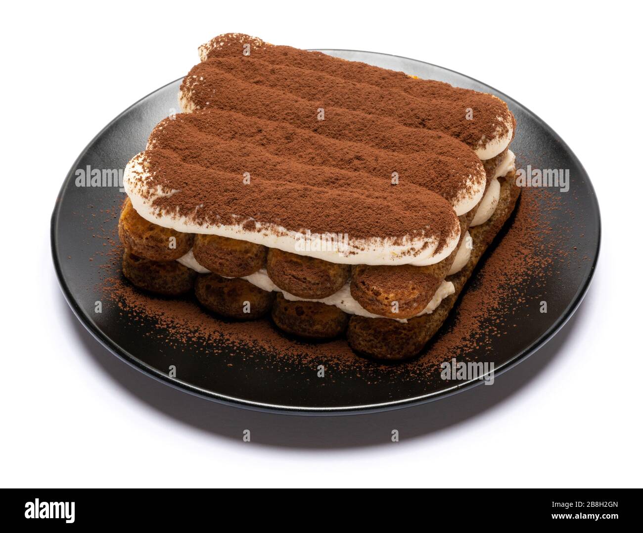 Classic tiramisu dessert on ceramic plate isolated on white background ...
